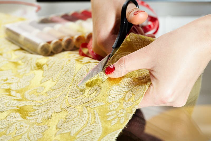 Cutting the Yellow Silk Cloth Stock Photo - Image of hands, clothing ...