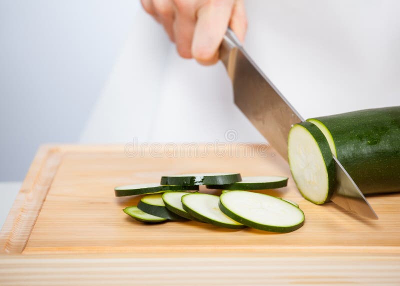 Cutting zucchini stock photo. Image of cuisine, marrow - 55658988