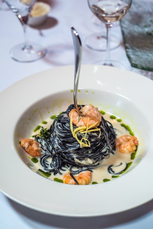 Cuttlefish ink spaghetti stock photo. Image of peas, paper - 40245100