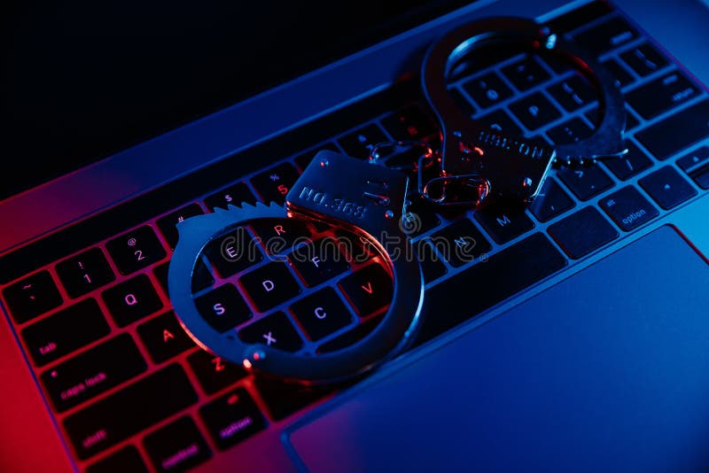 Cyber Crime, Online Piracy and Internet Web Hacking Concept. Handcuffs ...