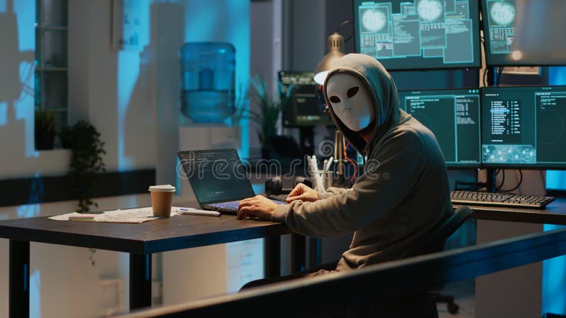 Cyber Impostor with Anonymous Mask Breaking Security System Stock Image ...