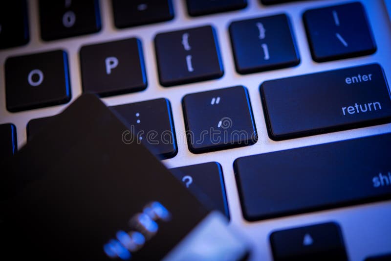 Cyber Security Concept: Credit Card on a Computer Keyboard in a Dark ...
