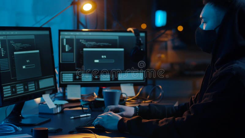 Hacker in Mask with Computer Making Cyber Attack Stock Footage - Video ...