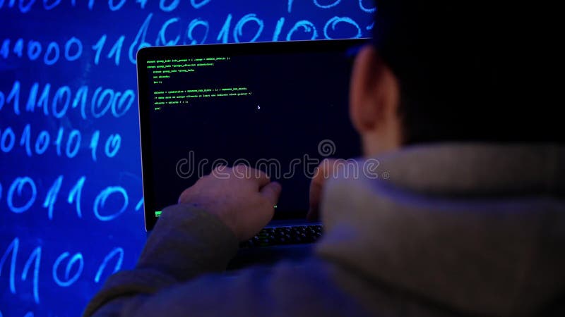 Cybercrime, Hacking and Technology Concept - Male Hacker in Dark Room ...