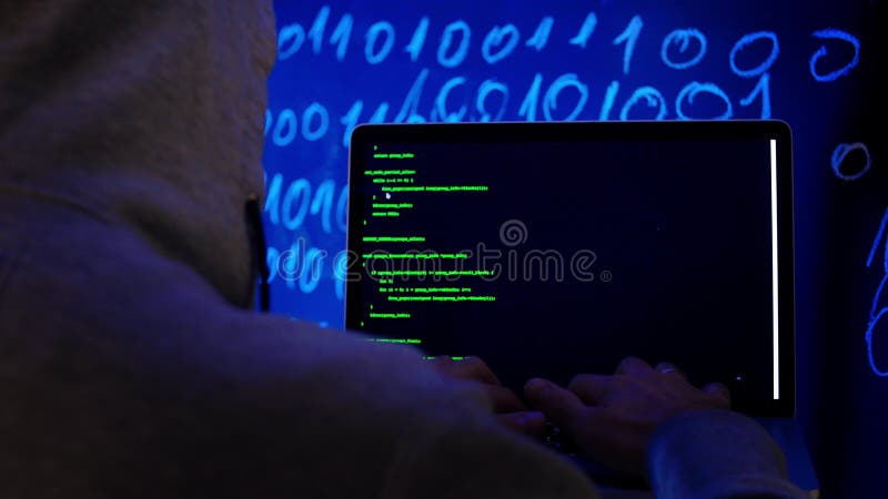 Hacker in Dark Room Writing Programming Code or Using Virus Program for ...