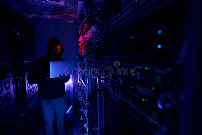 Cybercrook Typing on Notebook in Server Room Stock Image - Image of ...