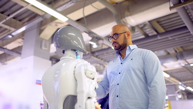 Humanoid Autonomous Robot with Cardboard Box in Hand. Cybernetic System ...