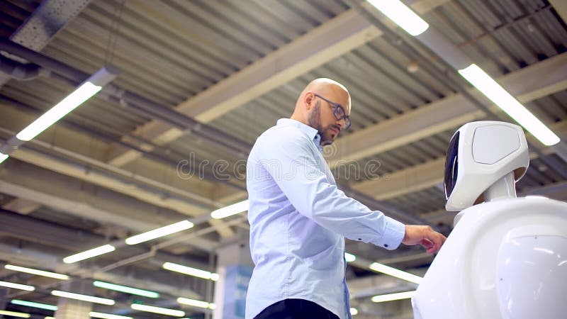 Humanoid Autonomous Robot with Cardboard Box in Hand. Cybernetic System ...