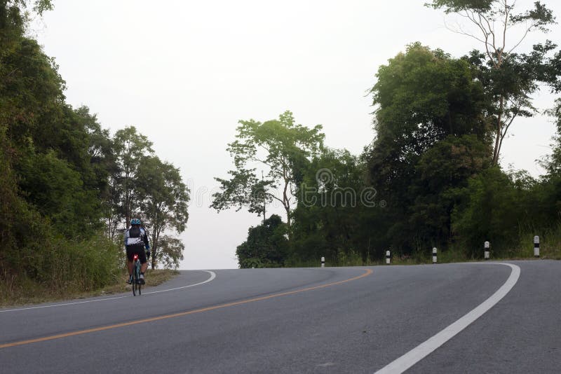 Cycle on the Asphalt Road on a Hill. Stock Image - Image of active ...