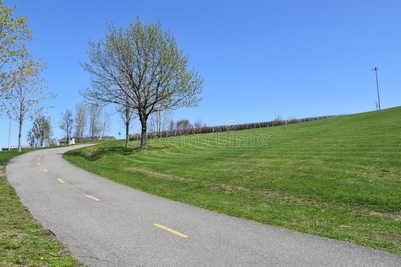 The cycle path in spring stock photo. Image of canada - 340541394