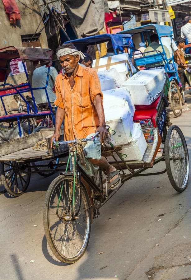 Cycle Rickshaw Transports Passenger in Delhi, India Editorial Photo ...