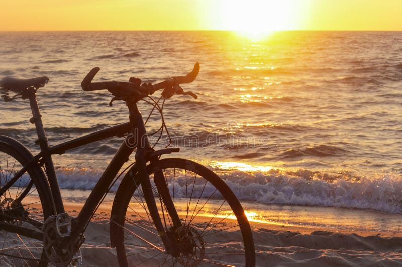 Cycling Along the Sea Coast, Bicycle at Sunset Stock Image - Image of ...
