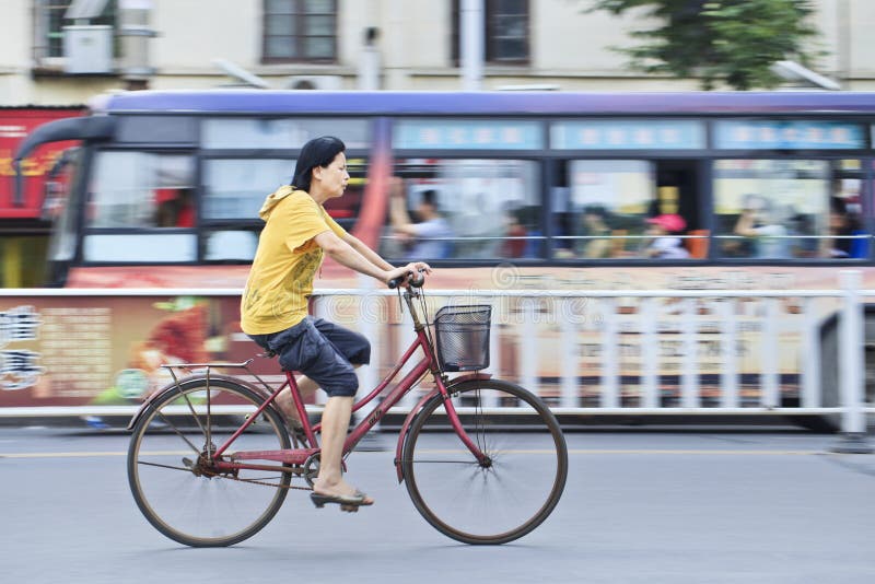 Cycling Chinese Female Elderly Passes an Outside Bookstore, Tianjin ...
