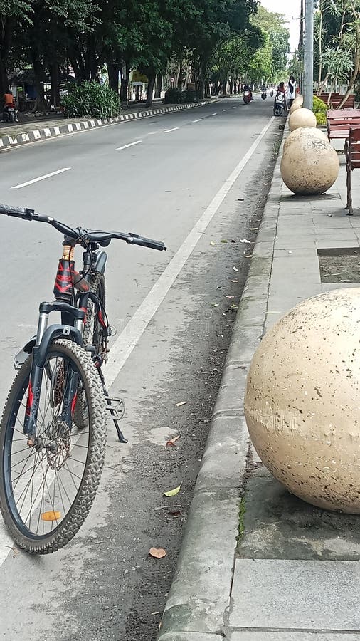 Cycling on city roads stock image. Image of physical - 392654991