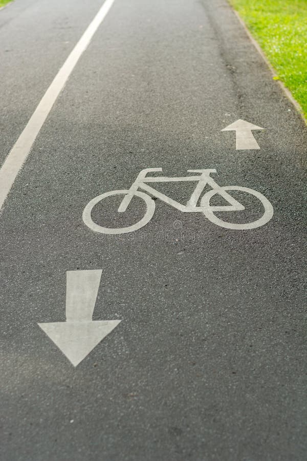 A Cycling Lane Sign on the Ground Stock Photo - Image of sport, park ...