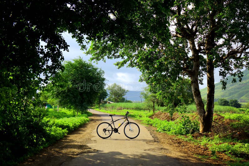 Cycling outside the town stock photo. Image of cycling - 153661752