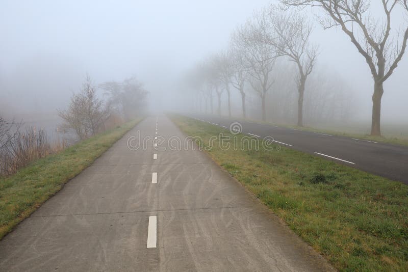 Cycling Path in Countryside in Dense Fog Stock Image - Image of morning ...