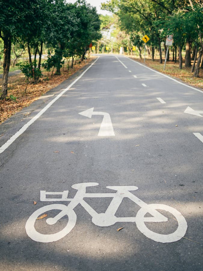 Cycling Path in the Park. Bicycle Traffic Sign Painted on the Floor ...