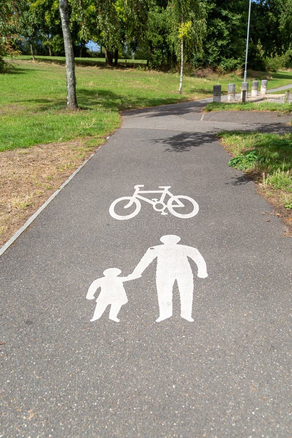 A Cycling and Pedestrian Shared Path Sign Painted on a Pathway Stock ...