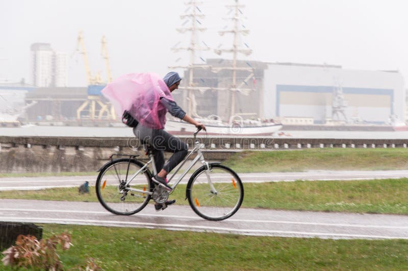 Cycling in rain stock photo. Image of sport, bicycle - 97470710
