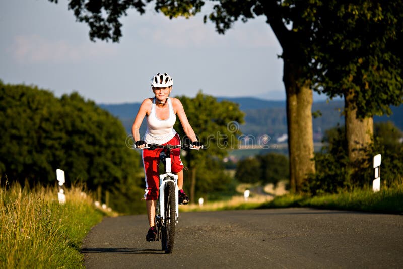 Cycling woman stock image. Image of people, biking, female - 22899889