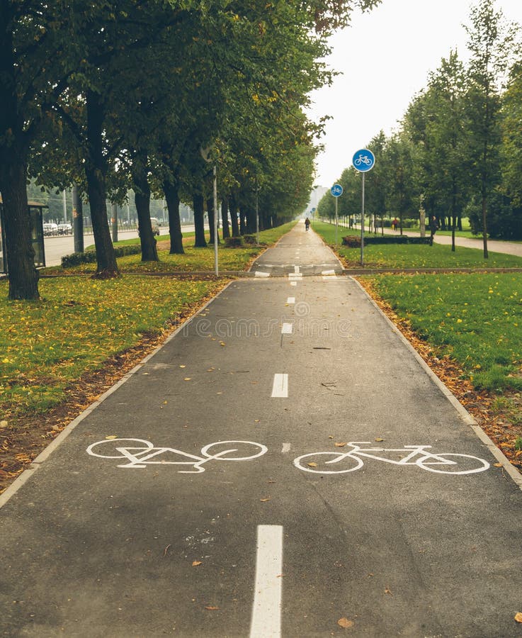 Cyclist on a bicycle path stock photo. Image of line - 107728512