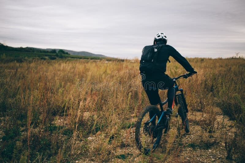 A cyclist in black stock photo. Image of country, road - 101742100