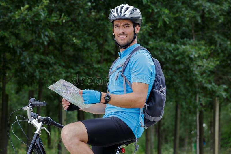 Cyclist Man Checking Map and Looking Around Stock Photo - Image of ...