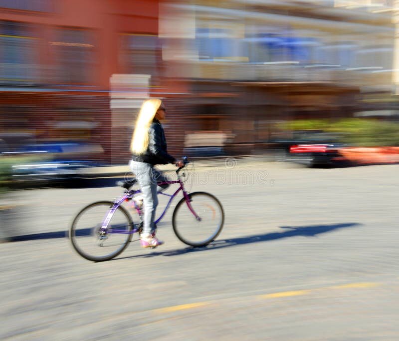 Cyclist in Motion Going Down the Street Stock Photo - Image of blur ...