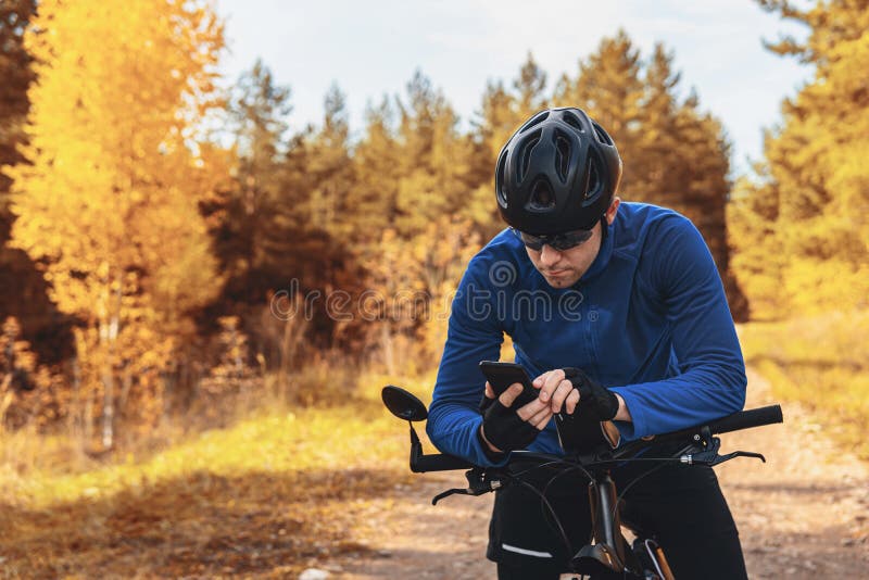Cyclist on Mountain Bike Using Navigation App on Smartphone, Exploring ...