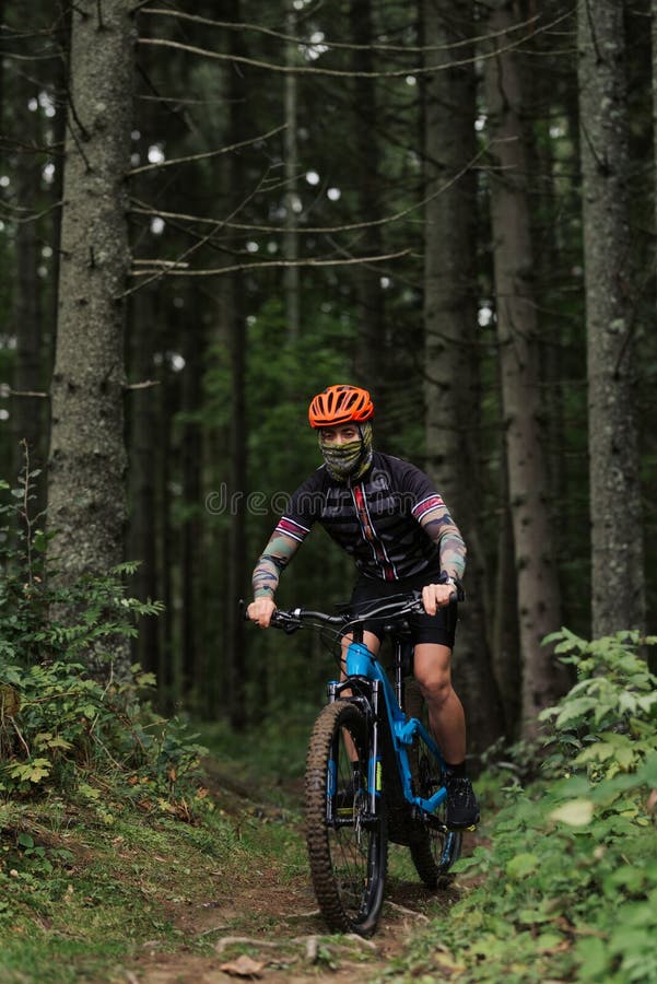 A Cyclist Rides a Bicycle. Down the Hill Stock Image - Image of helmet ...
