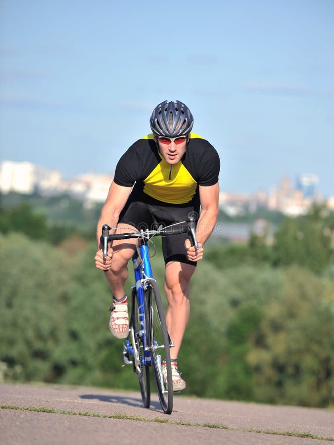 Cyclist riding a bicycle stock photo. Image of competitive - 24005328