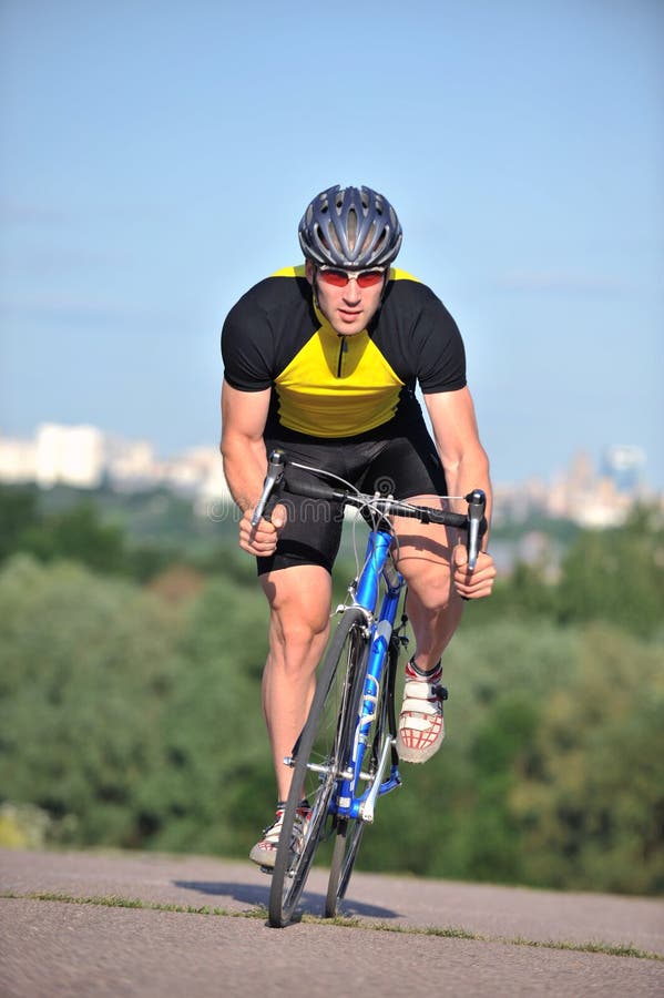 Cyclist riding a bicycle stock image. Image of competitor - 24005325