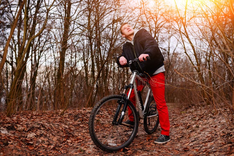 Cyclist Riding the Bike on the Trail in the Beautiful Spring Forest ...