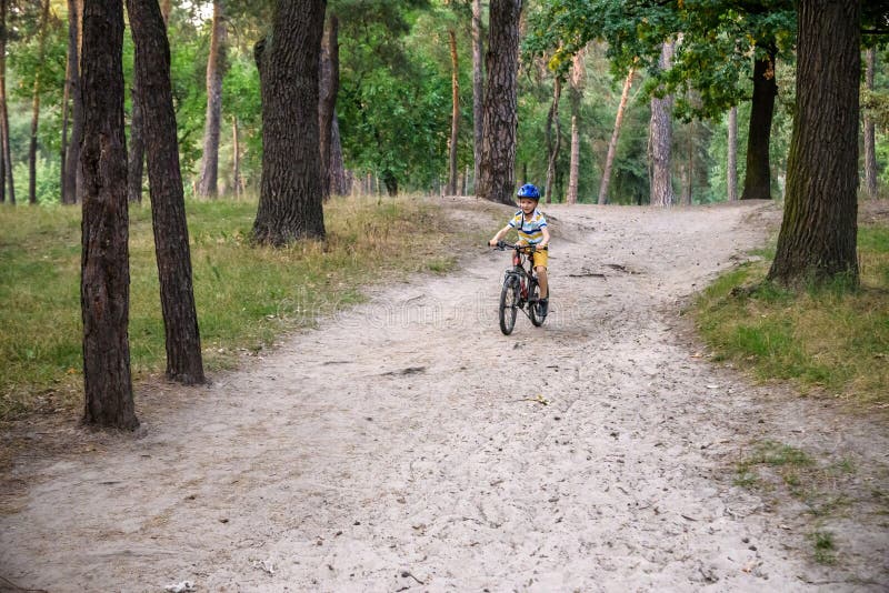 Cyclist Riding Down the Sandy Hill on the Offroad Trail Stock Photo ...