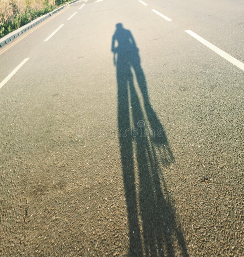 Cyclist Shadow on Tarmac Road Stock Photo - Image of cycling, sports ...