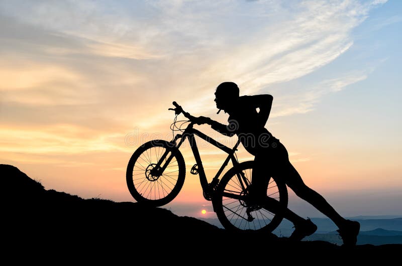 Cyclist in the sunset stock photo. Image of lifestyle - 39604294