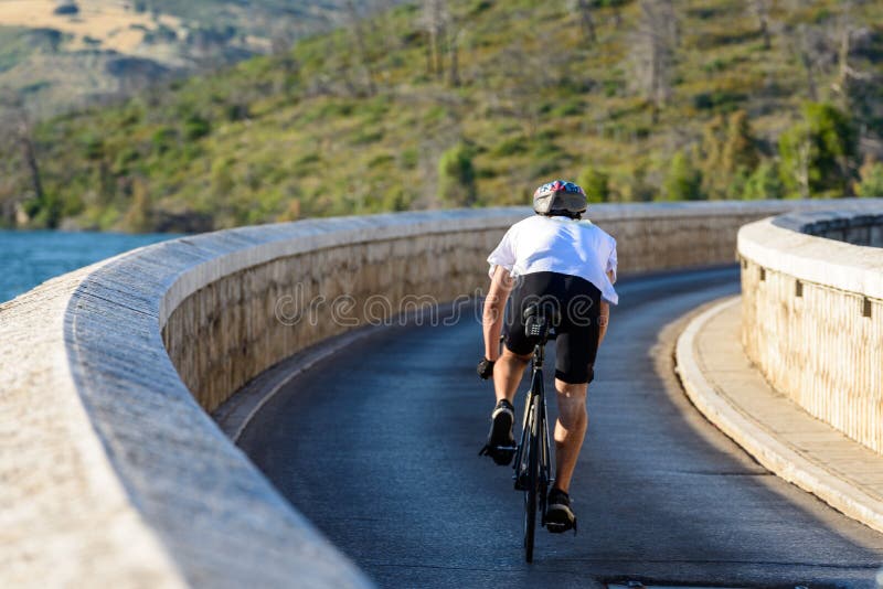 Cyclists Crossing the Marathon Dam Editorial Image - Image of bike ...