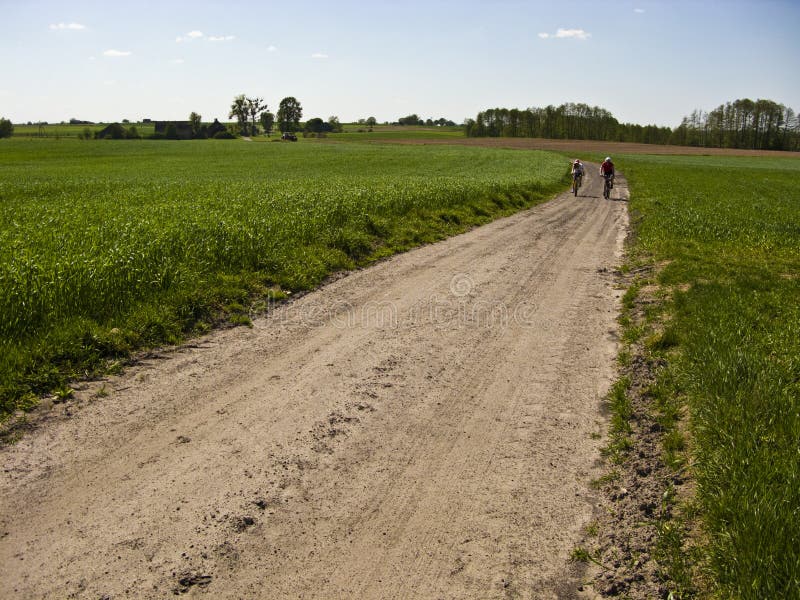 Cyclists in Spring or Summer Dirt Path Stock Image - Image of activity ...