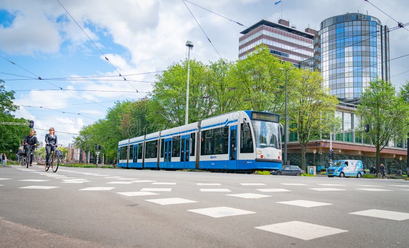 Cyclists and Train Cross Intersection in City Together Editorial Stock ...