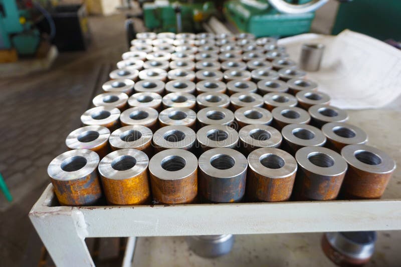 Cylindrical Metal Parts are Located on the Rack after Turning. Stock ...