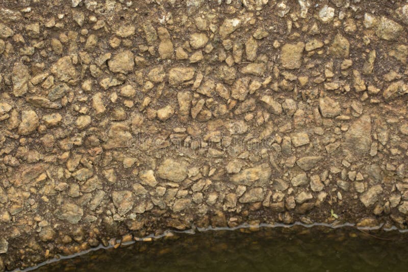 The Cylindrical Well Made of Granite Stone Wall Texture. Stock Photo ...