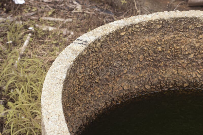 The Cylindrical Well Made of Granite Stone Wall Texture. Stock Photo ...