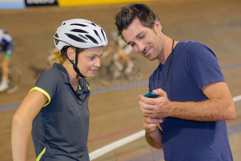 Cylist and Trainer Consulting Stopwatch Stock Image - Image of counting ...