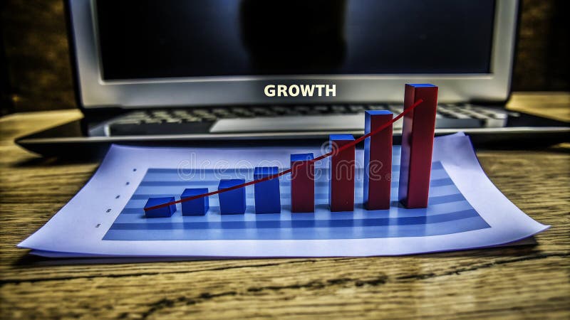Financial Investment Success: Rising Graph on Report with Laptop in ...