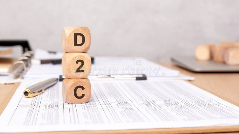 D2C Letters on Wooden Cubes Stacked on Office Paperwork Stock Image ...