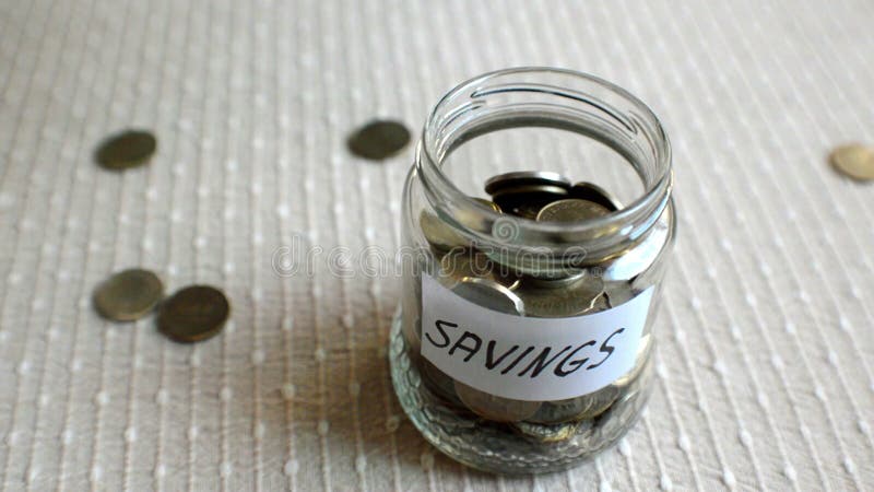 Saving Jar Being Filled Up with Coins Stock Photo - Image of metal ...