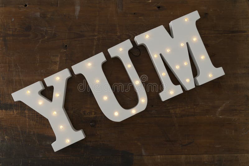 3D Letters with Illuminated Embedded LED Lights Spelling YUM Stock ...