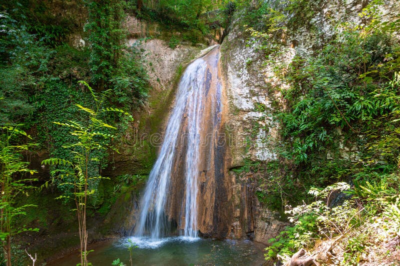 Waterfall Cascading Down a Pool in Southern Limestone Alps, Italy Stock ...