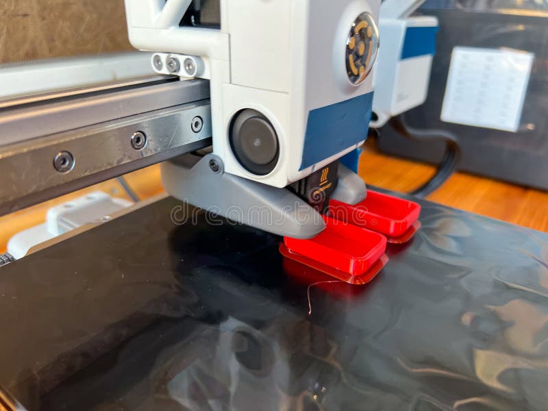 3d Printer Creating Red Plastic Parts on Build Surface Stock Photo ...